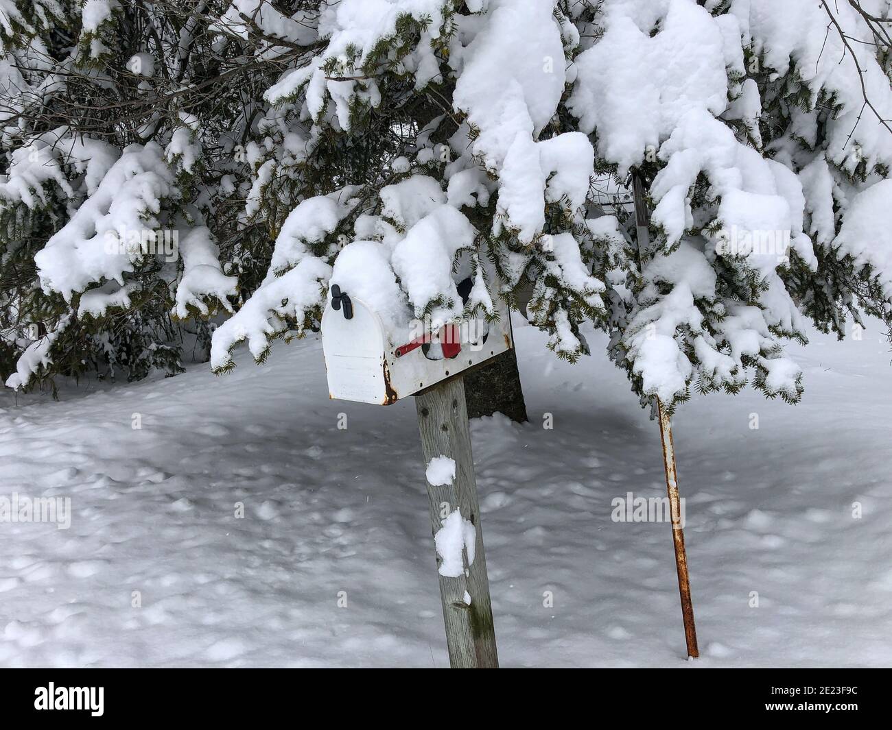 Metallic post box covered with snow in Stock Photo - Alamy