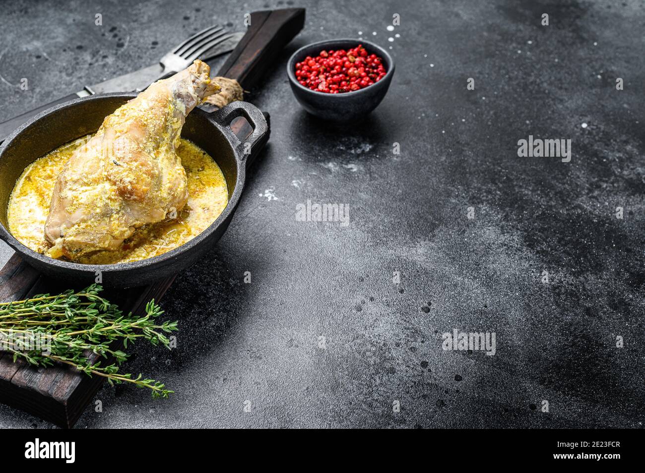 Roasted Rabbit Haunches in Pan with Stewed Vegetables. Black background ...
