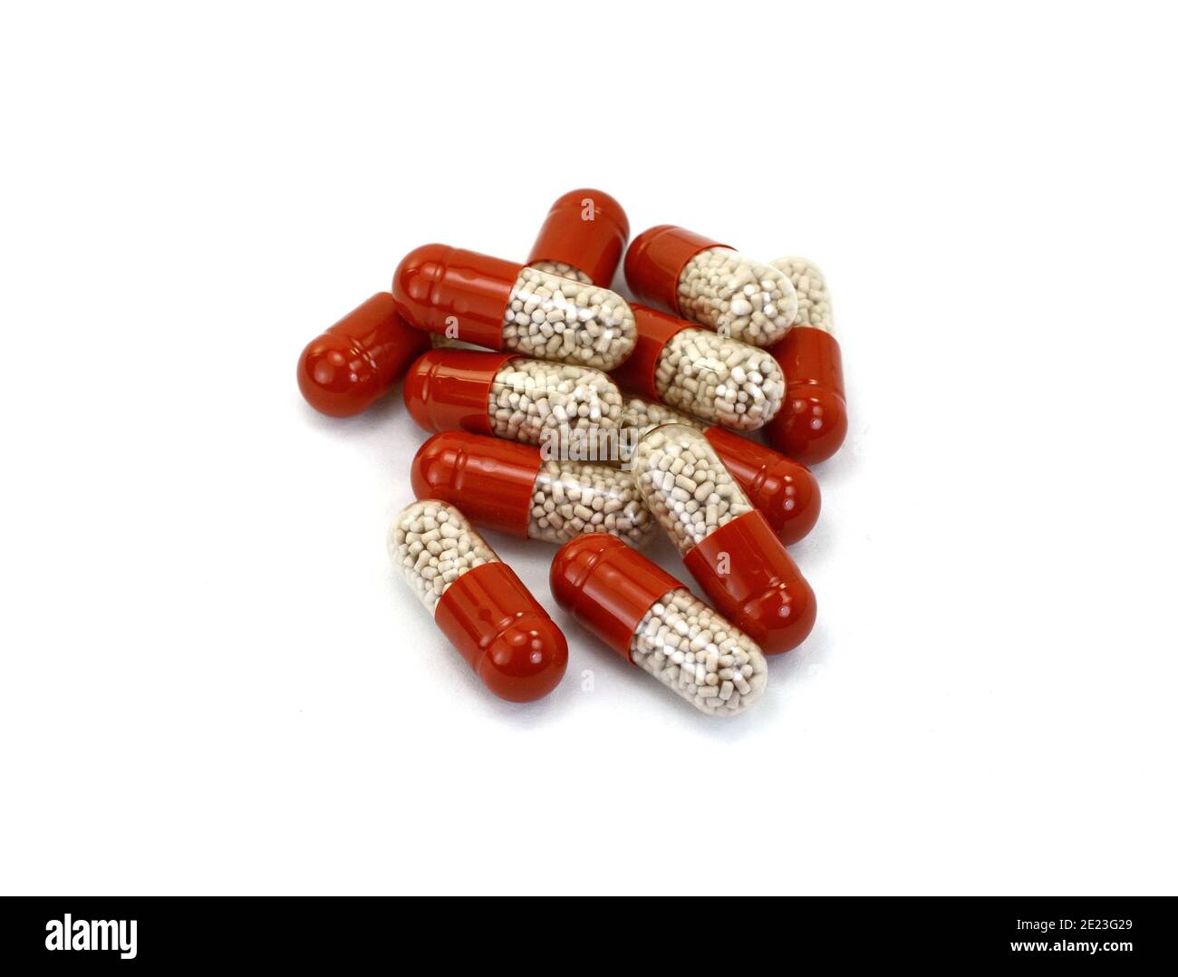 red transparent capsule on white background Stock Photo - Alamy