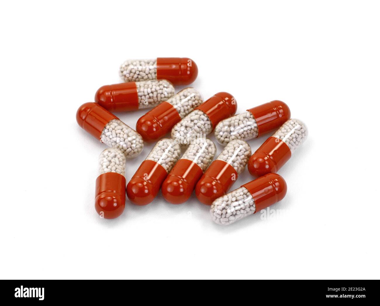 red transparent capsule on white background Stock Photo - Alamy