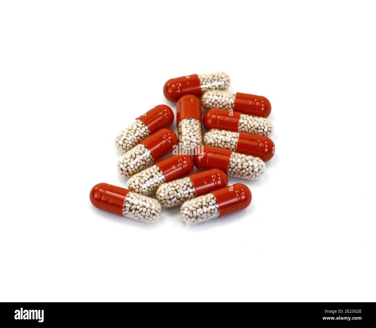 red transparent capsule on white background Stock Photo - Alamy