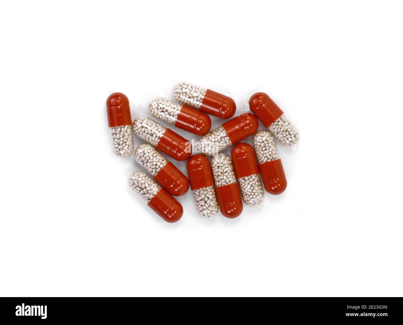 red transparent capsule on white background Stock Photo - Alamy