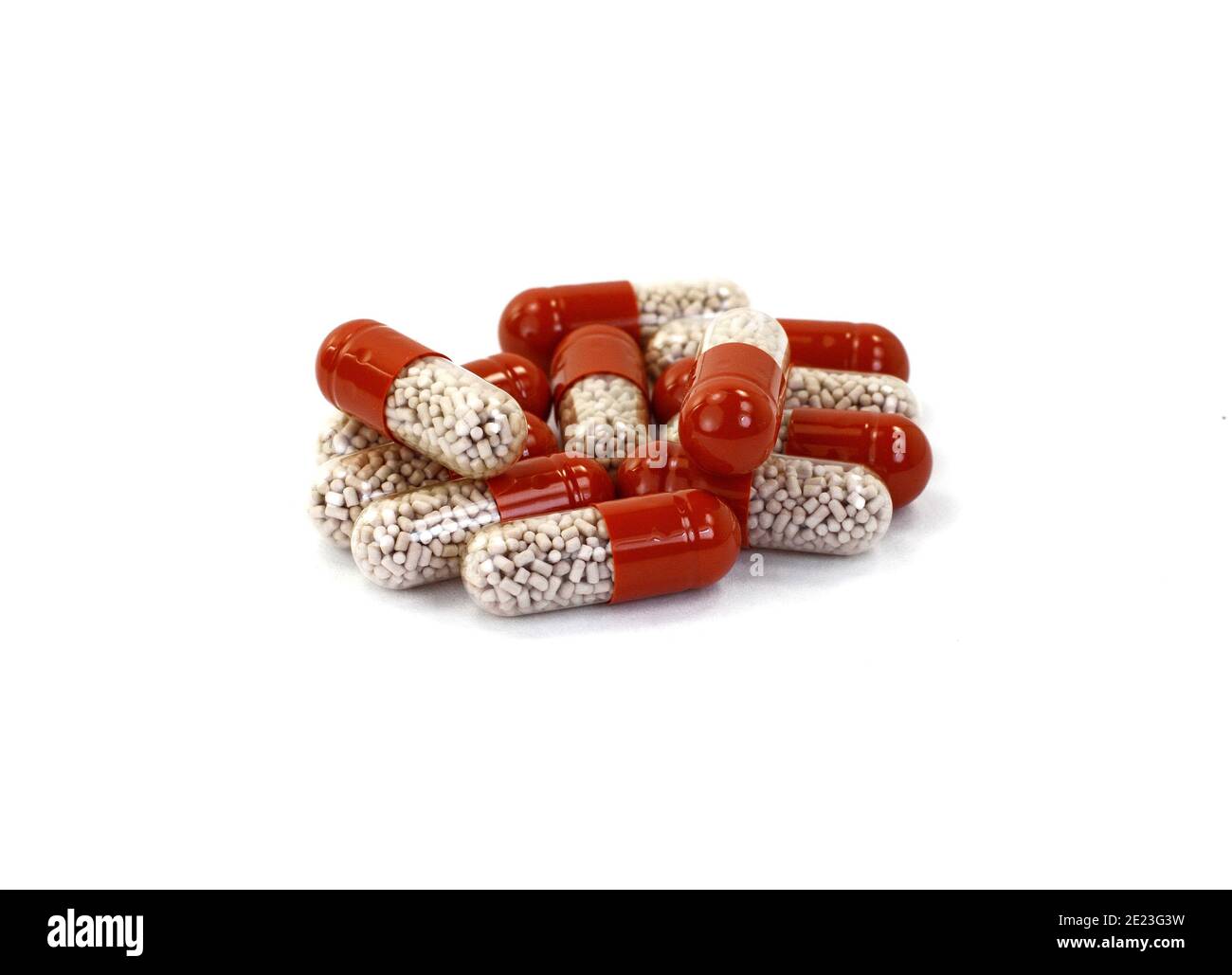 red transparent capsule on white background Stock Photo - Alamy