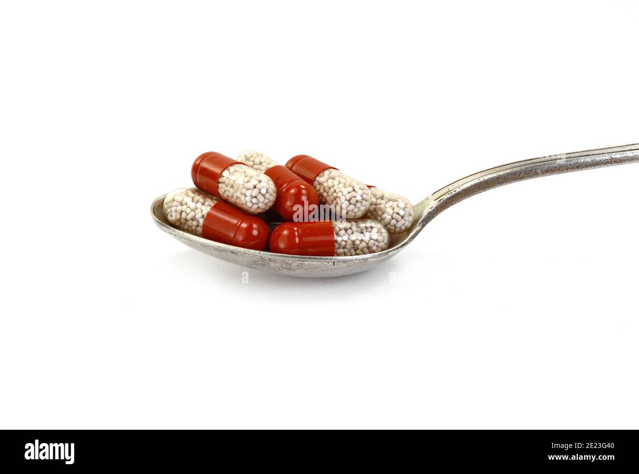 red transparent capsule on white background Stock Photo - Alamy