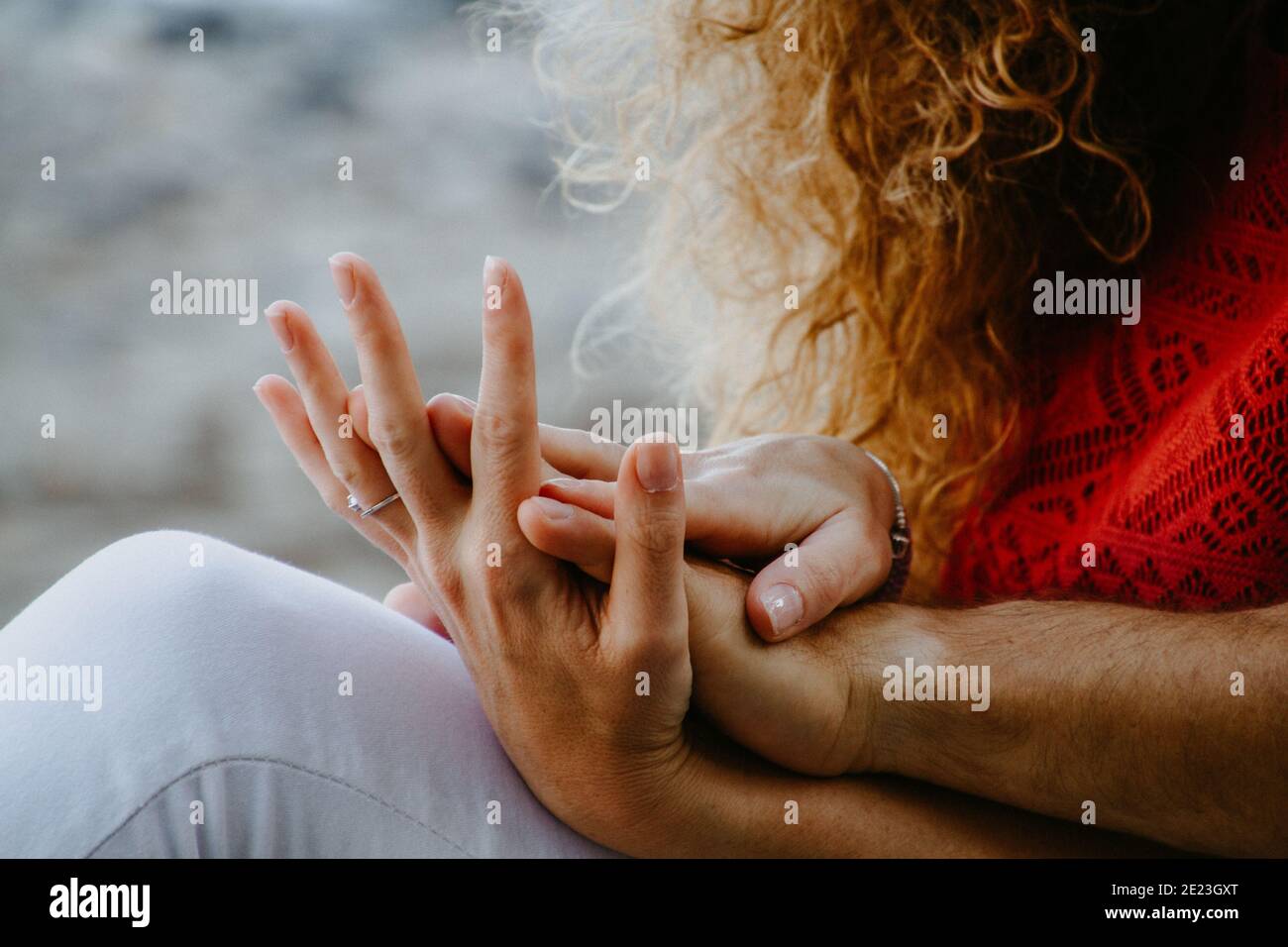 A couple caressing their hands Stock Photo - Alamy