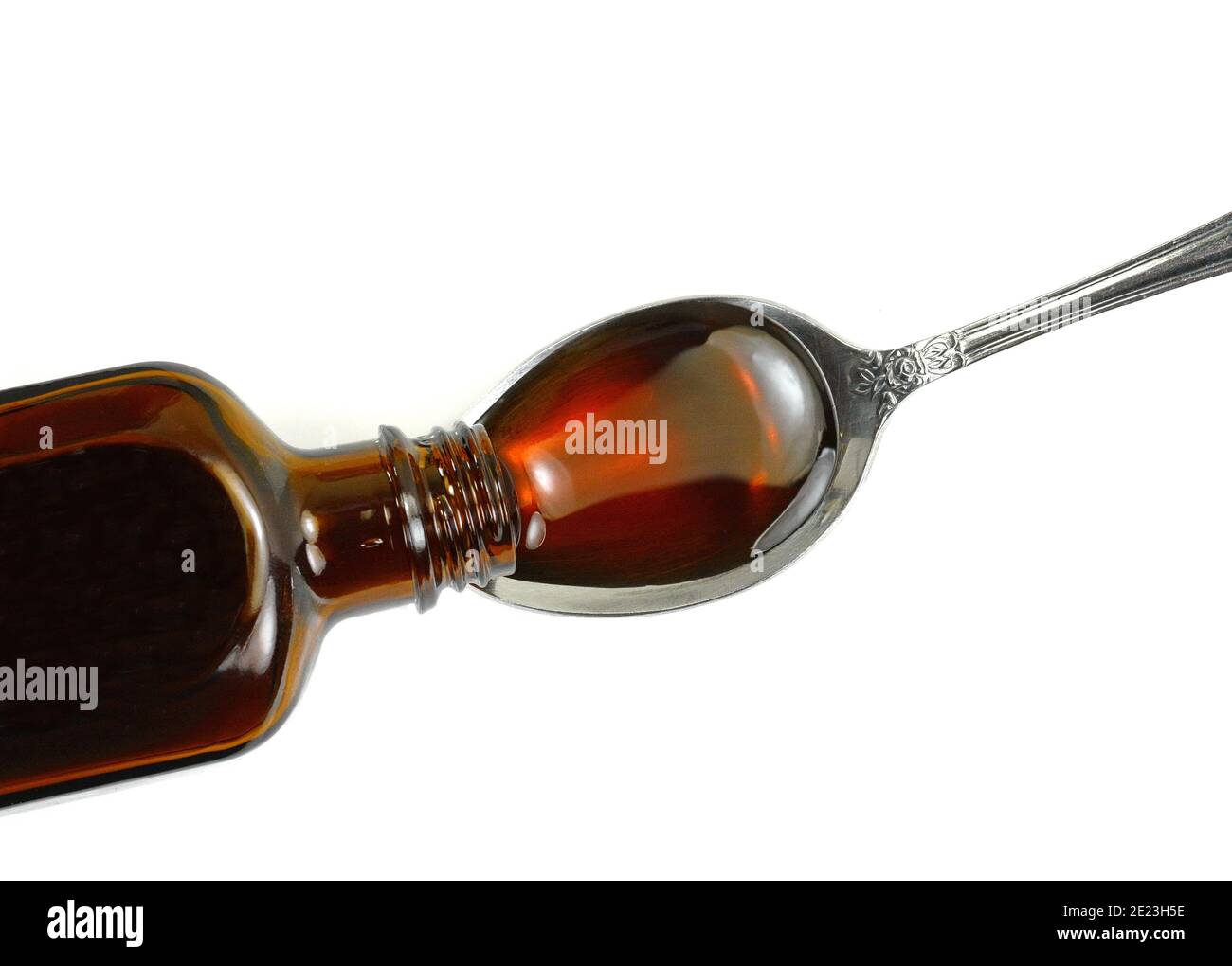 Spoonful of Cough Medicine isolated on a white background. medication ...