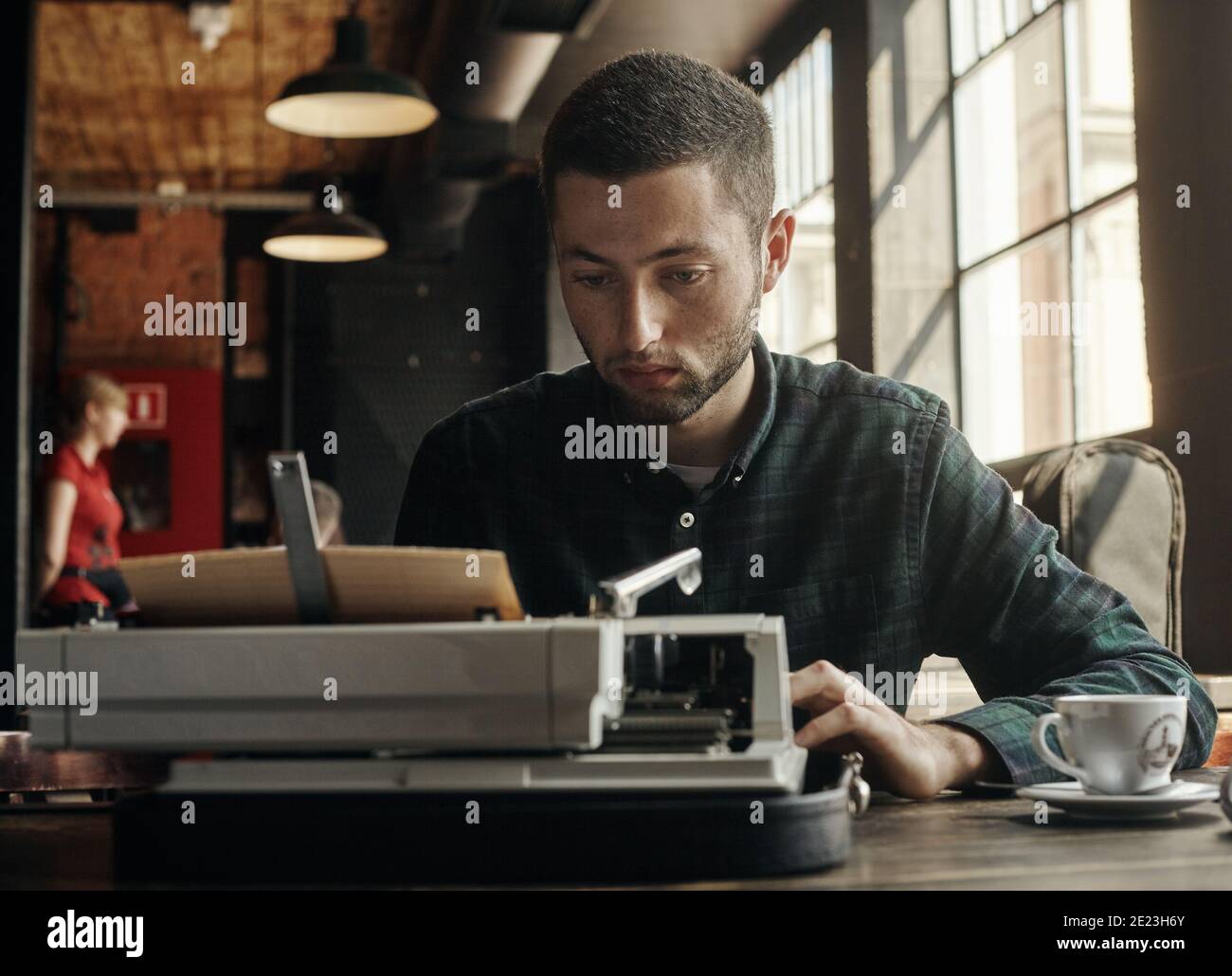 Professional handsome reporter working at office desk Stock Photo - Alamy