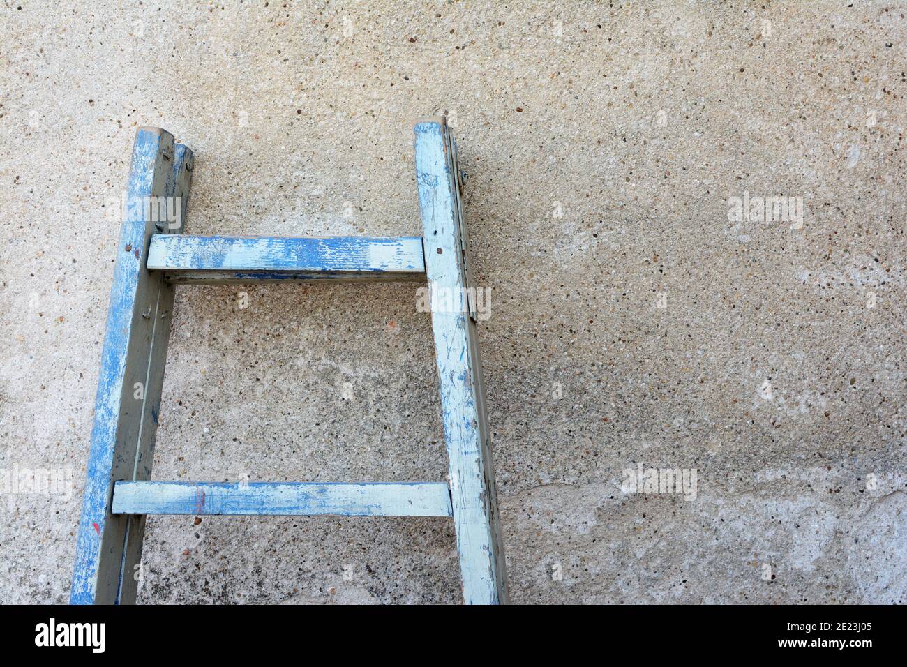 Blue wooden ladder and rough wall texture Stock Photo - Alamy