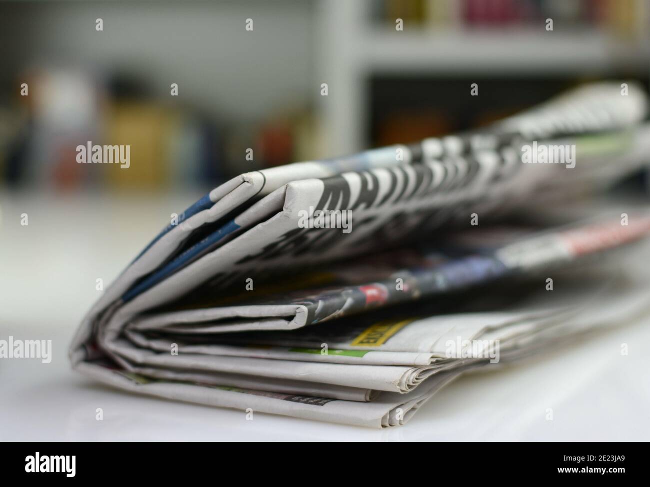 Newspapers folded and stacked concept for global communications ...