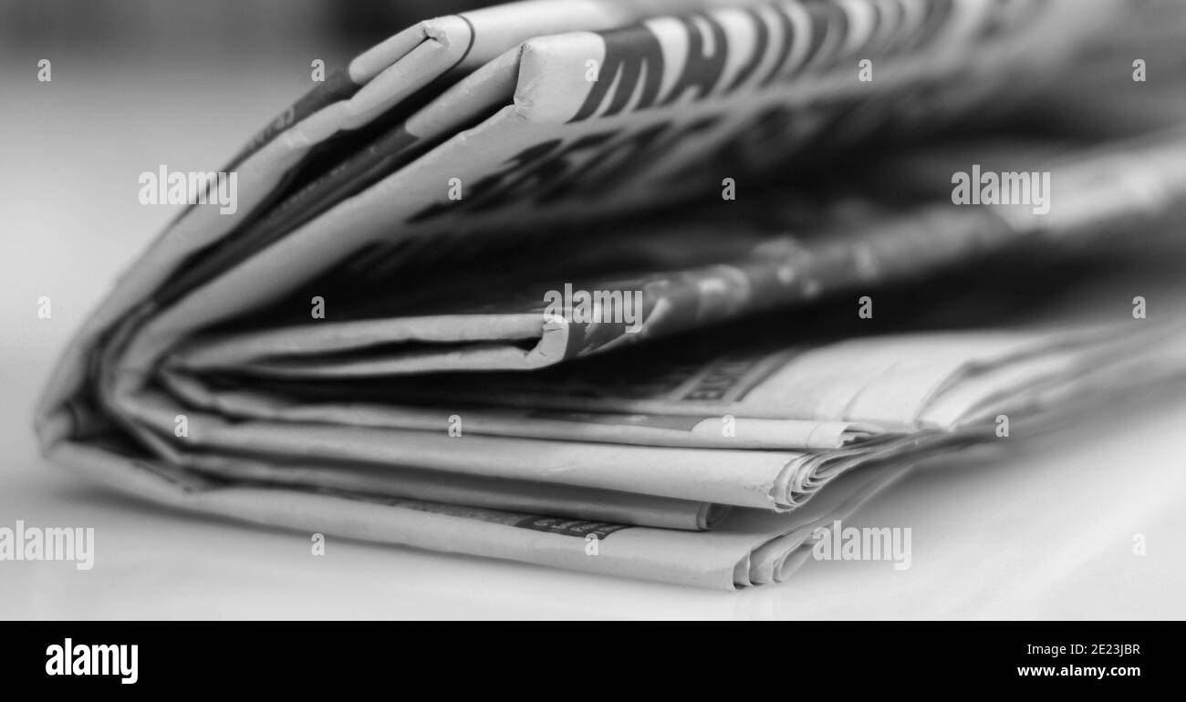 Newspapers folded and stacked concept for global communications ...
