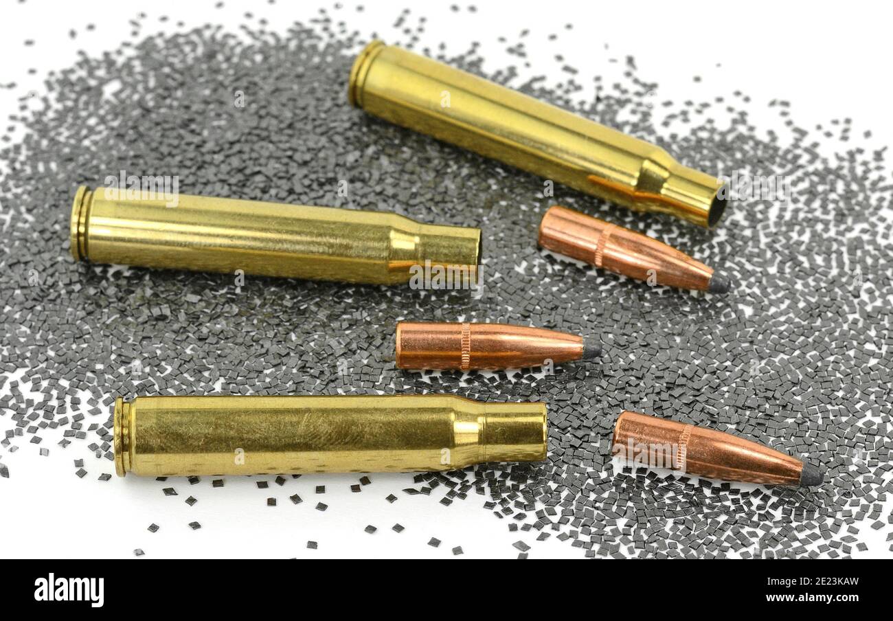 A rifle bullet, empty shell, gunpowder on white background. Hunting ...
