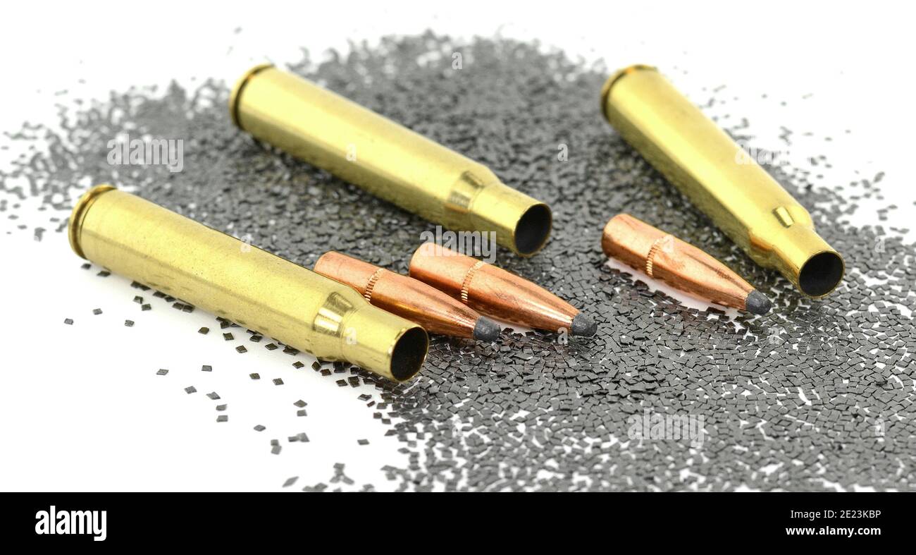 A rifle bullet, empty shell, gunpowder on white background. Hunting ...