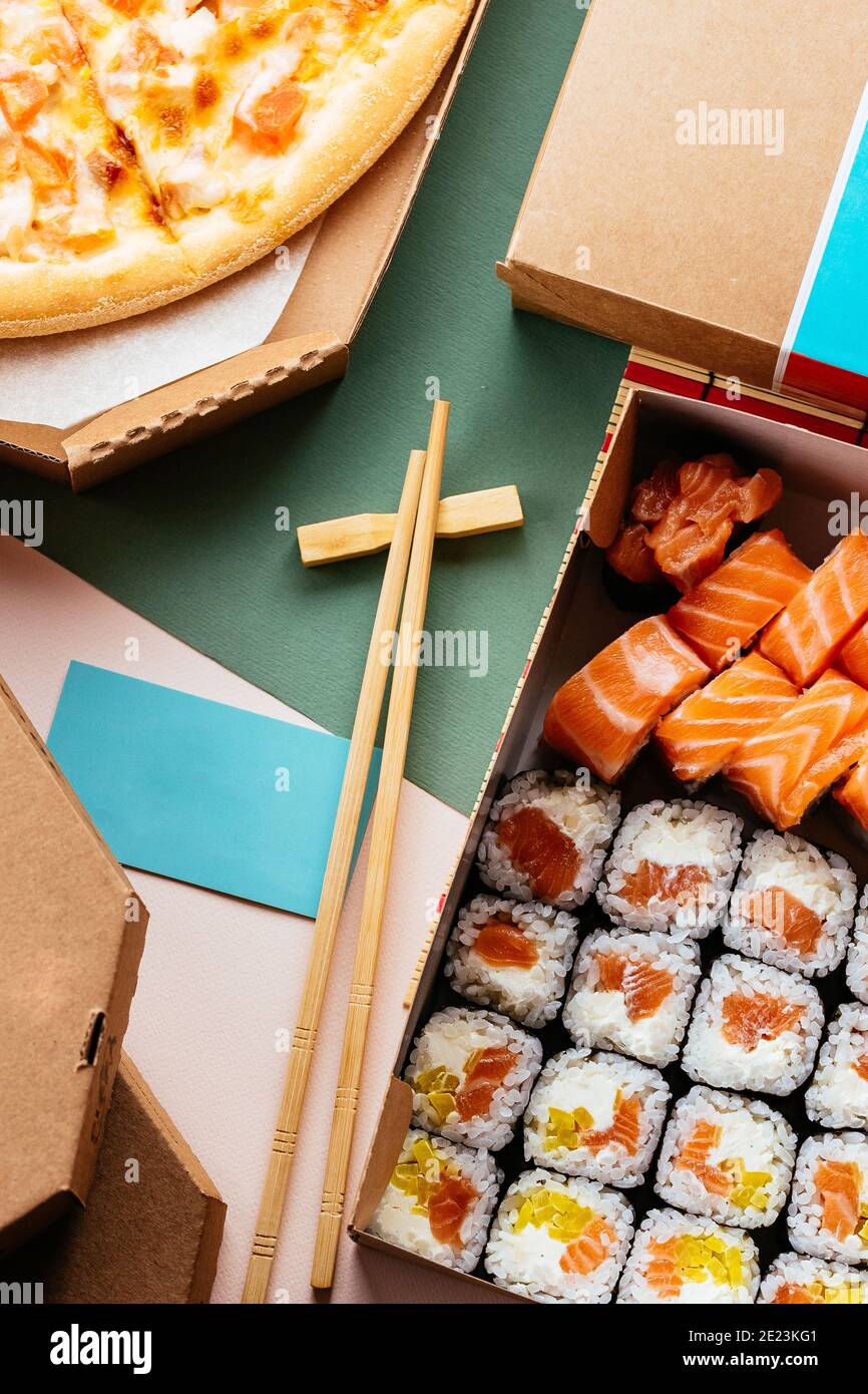 Set of delivery food. pizza sushi rolls Stock Photo - Alamy