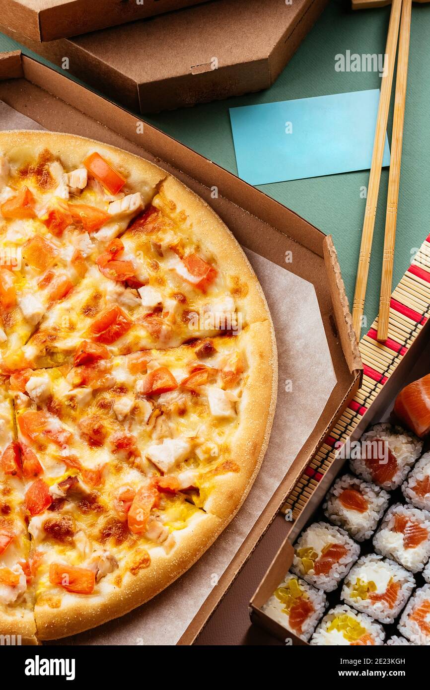 Set of delivery food. pizza sushi rolls Stock Photo - Alamy