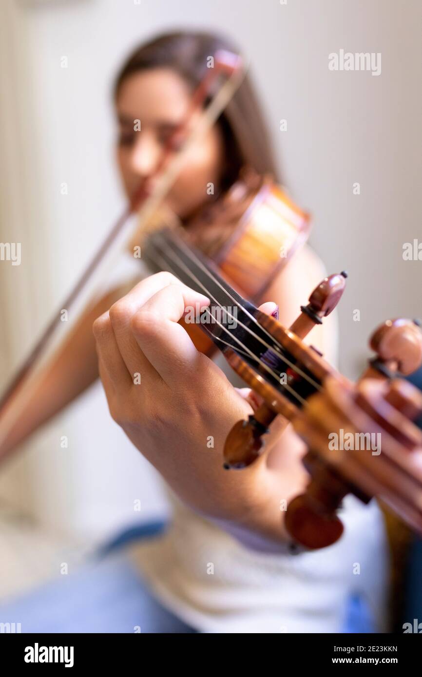 Portrait a musician girl playing a viola, selected focus Stock Photo ...
