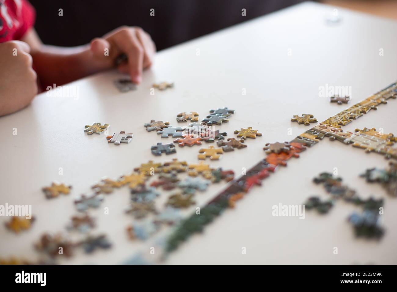 Child with puzzle hi-res stock photography and images - Alamy