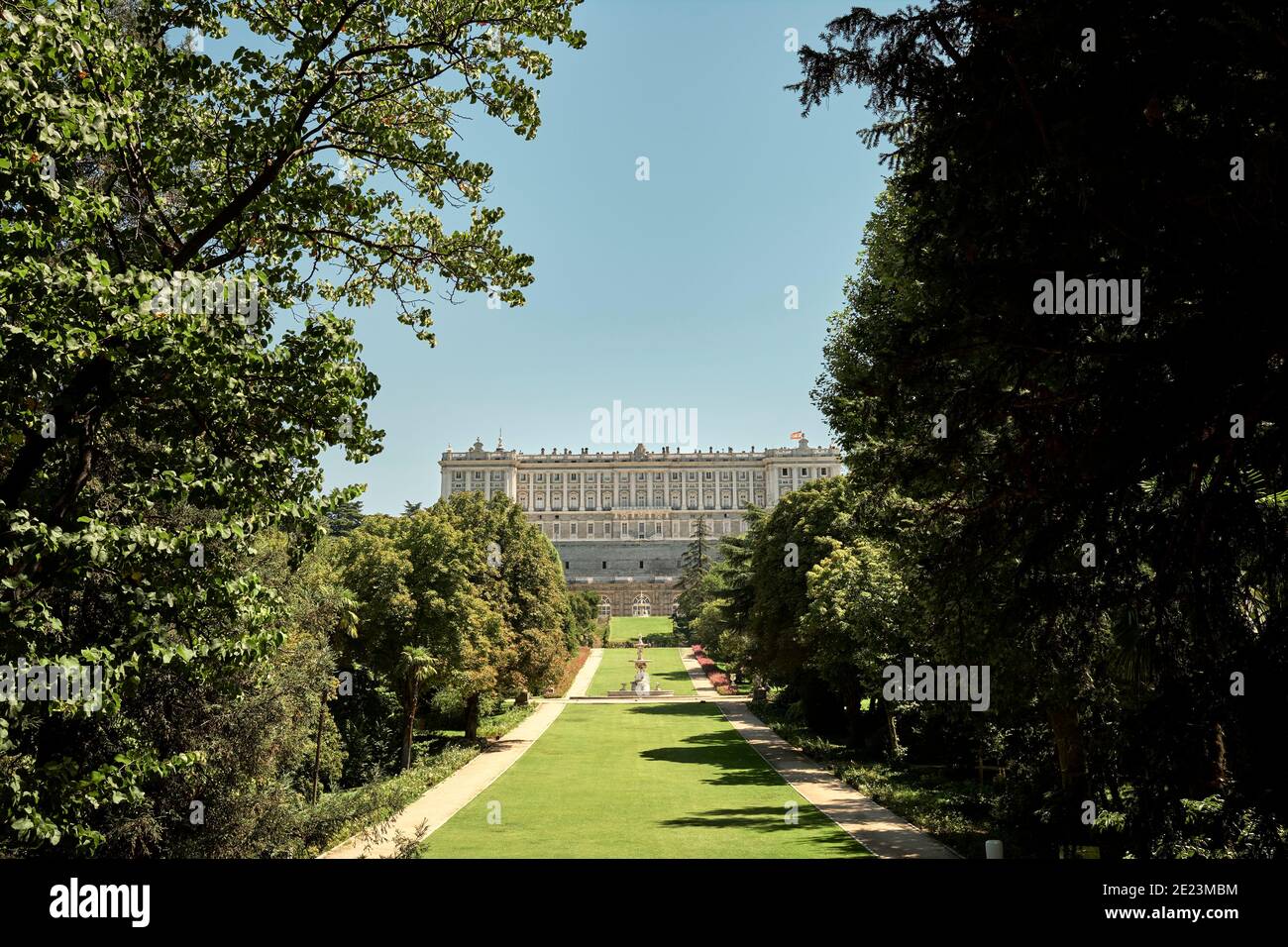 Scenery of Royal Palace of Madrid with lush lawn and garden with green ...