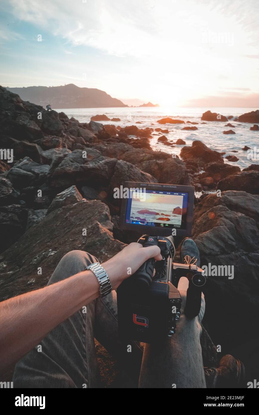 Getting the shot on the coast Stock Photo - Alamy