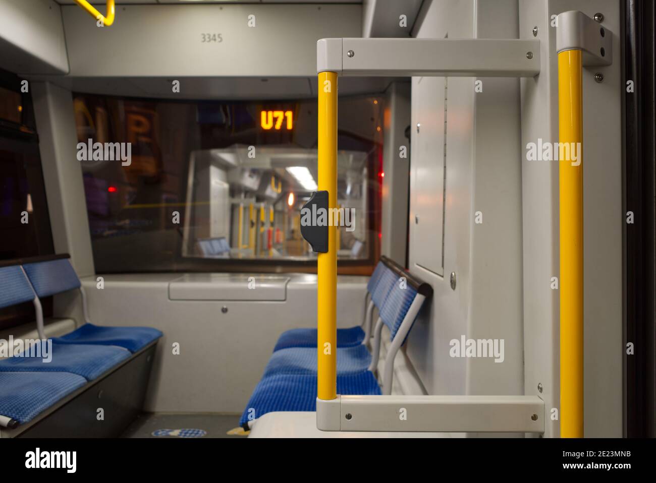 Selective focus at yellow handrail and interior view inside passenger ...