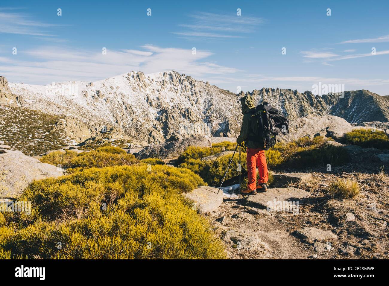 Young man looking at his objective summit during hike stop, Gredos ...