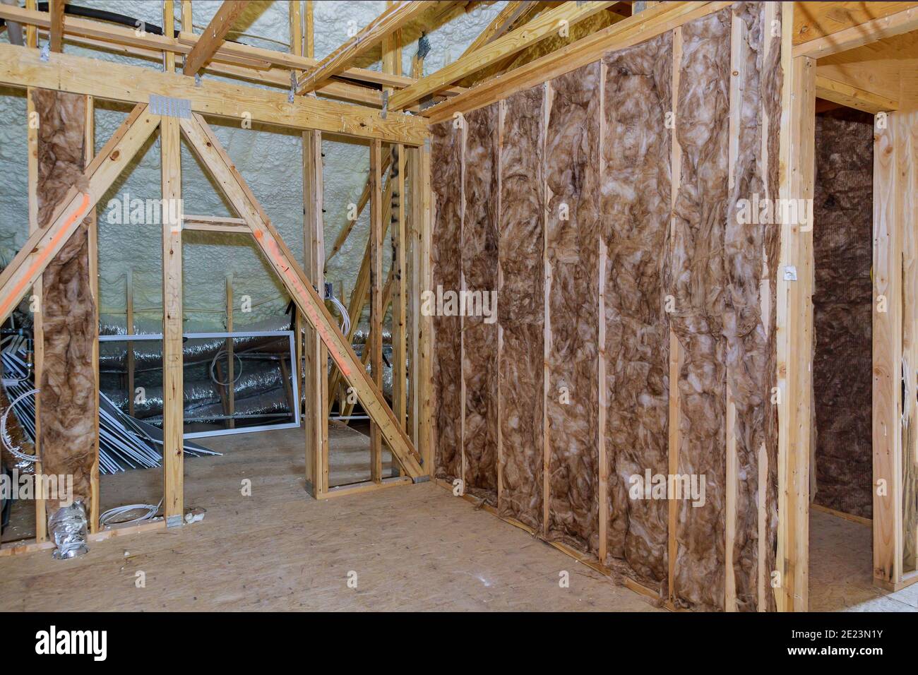 Fiberglass cold barrier insulation material in the sloping attic of a ...