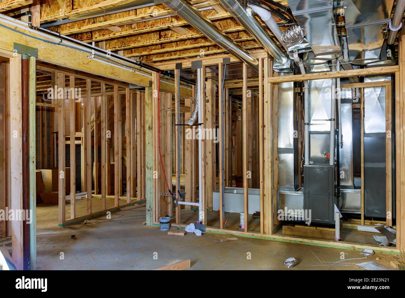Interior view of a basement under construction home framing with beam ...
