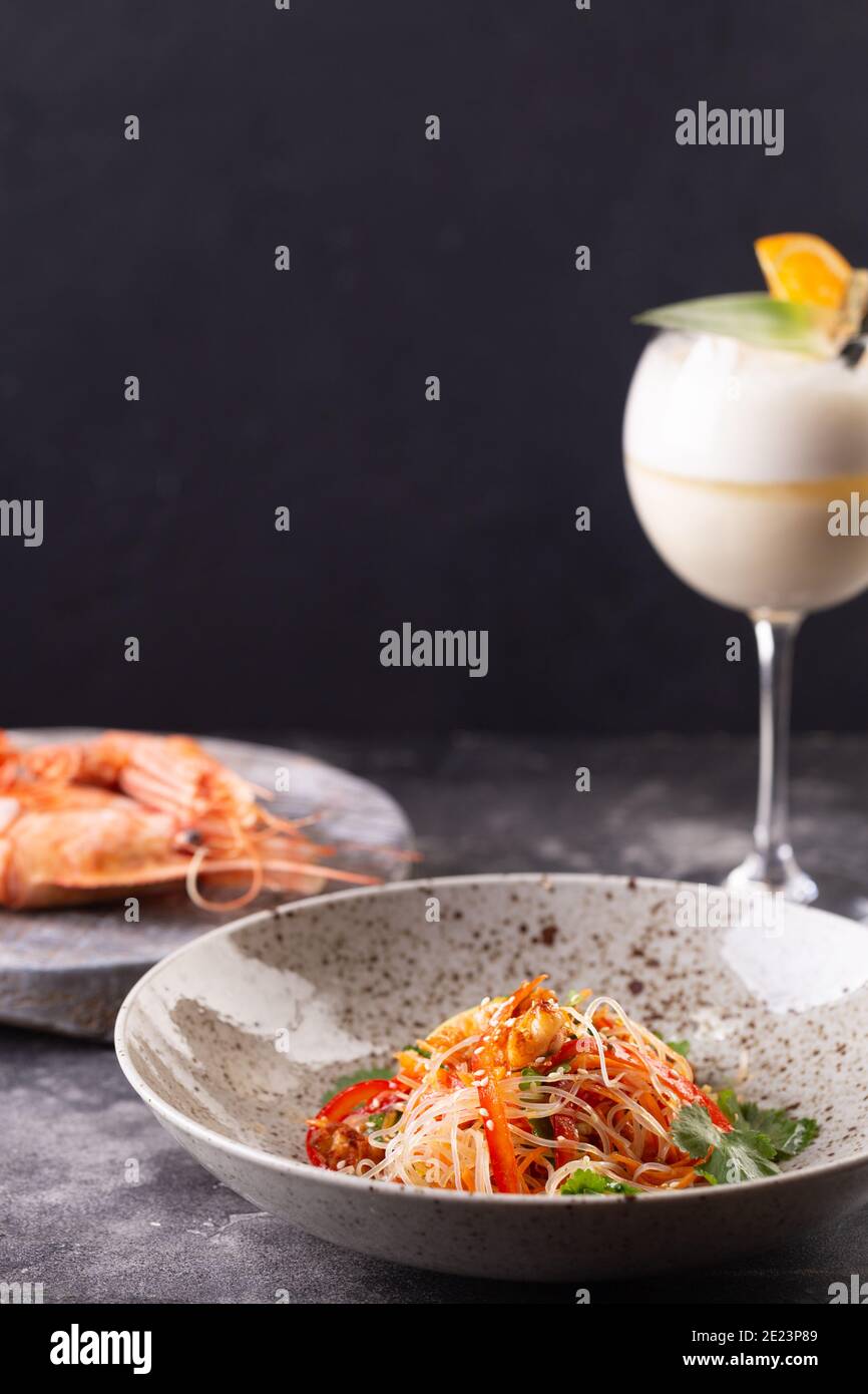 Funchose salad with shrimps and vegetables with sesame seeds and ...