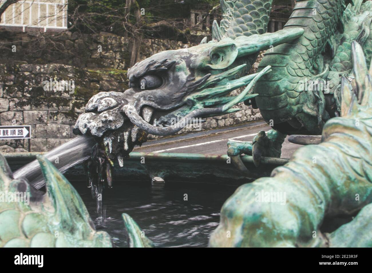 Selective focus shot of a dragon sculpture-fountain in Nikko, Japan ...