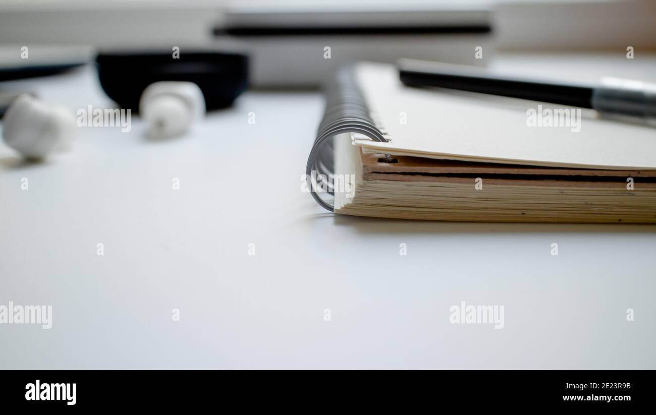 Notepad for notes on the rings and a black felt-tip pen. Workplace in ...