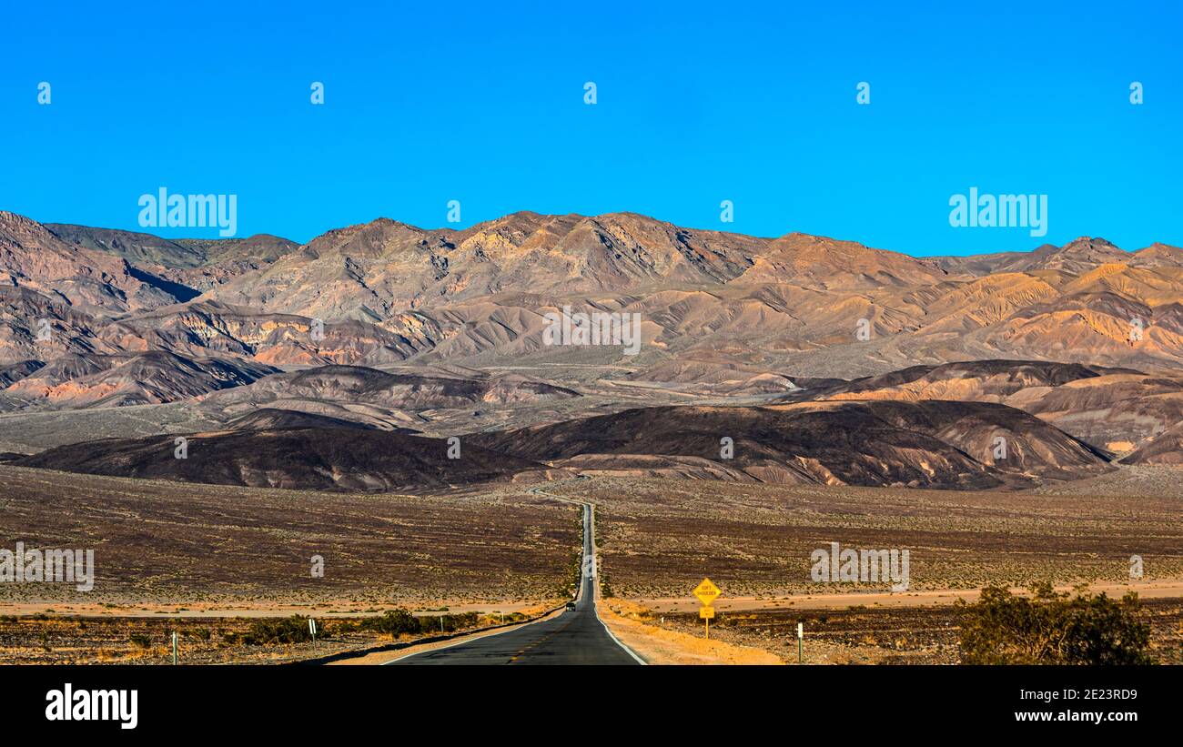 Beautiful scenery in Death Valley National Park. Road is visible ...