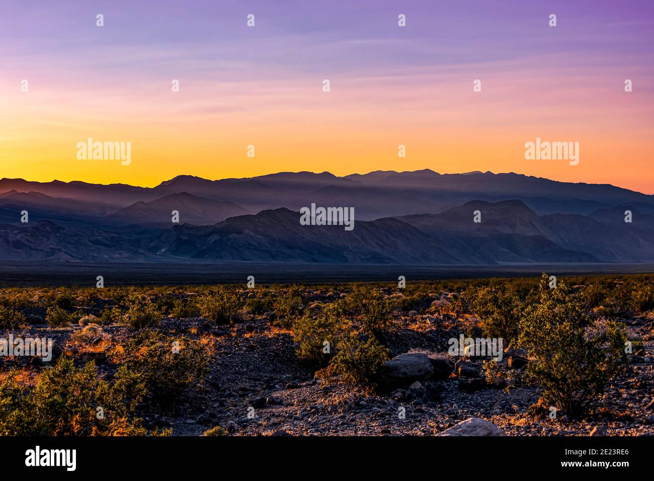 Beautiful scenery in Death Valley National Park. Orange and purple sky ...