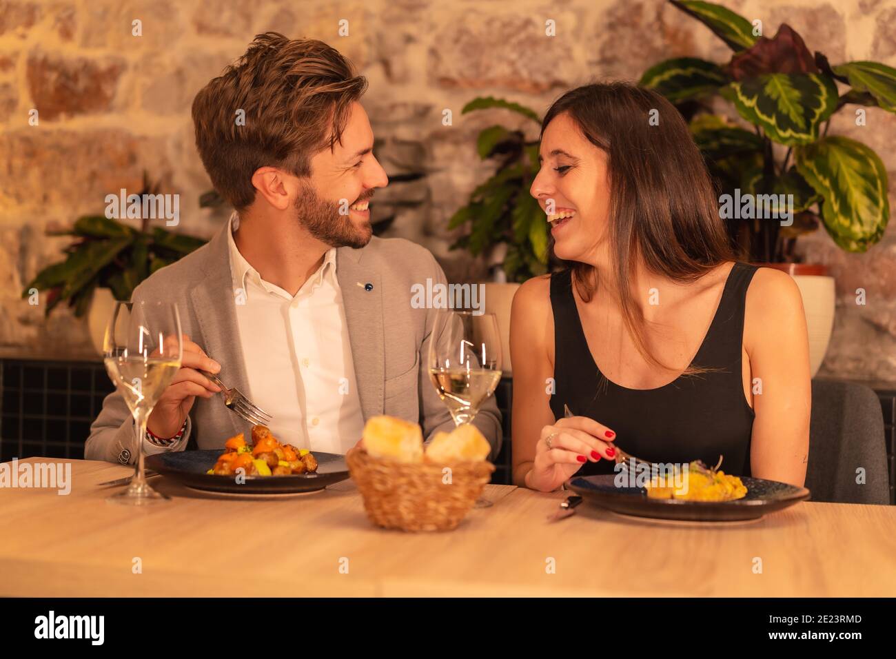 Happy loving couple enjoying dinner in a restaurant Stock Photo - Alamy