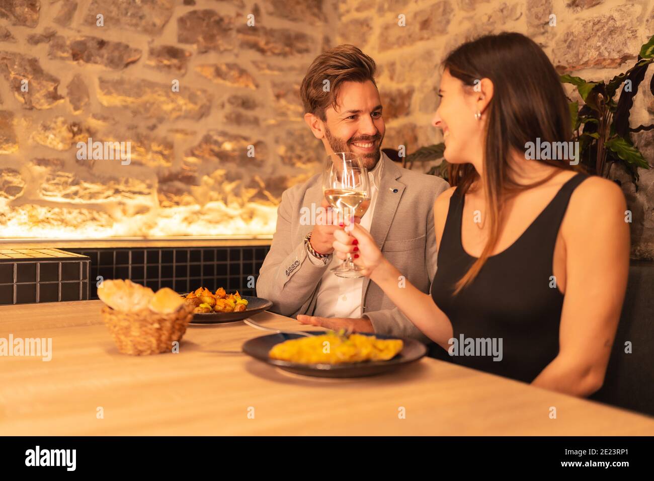 Happy loving couple enjoying dinner in a restaurant Stock Photo - Alamy