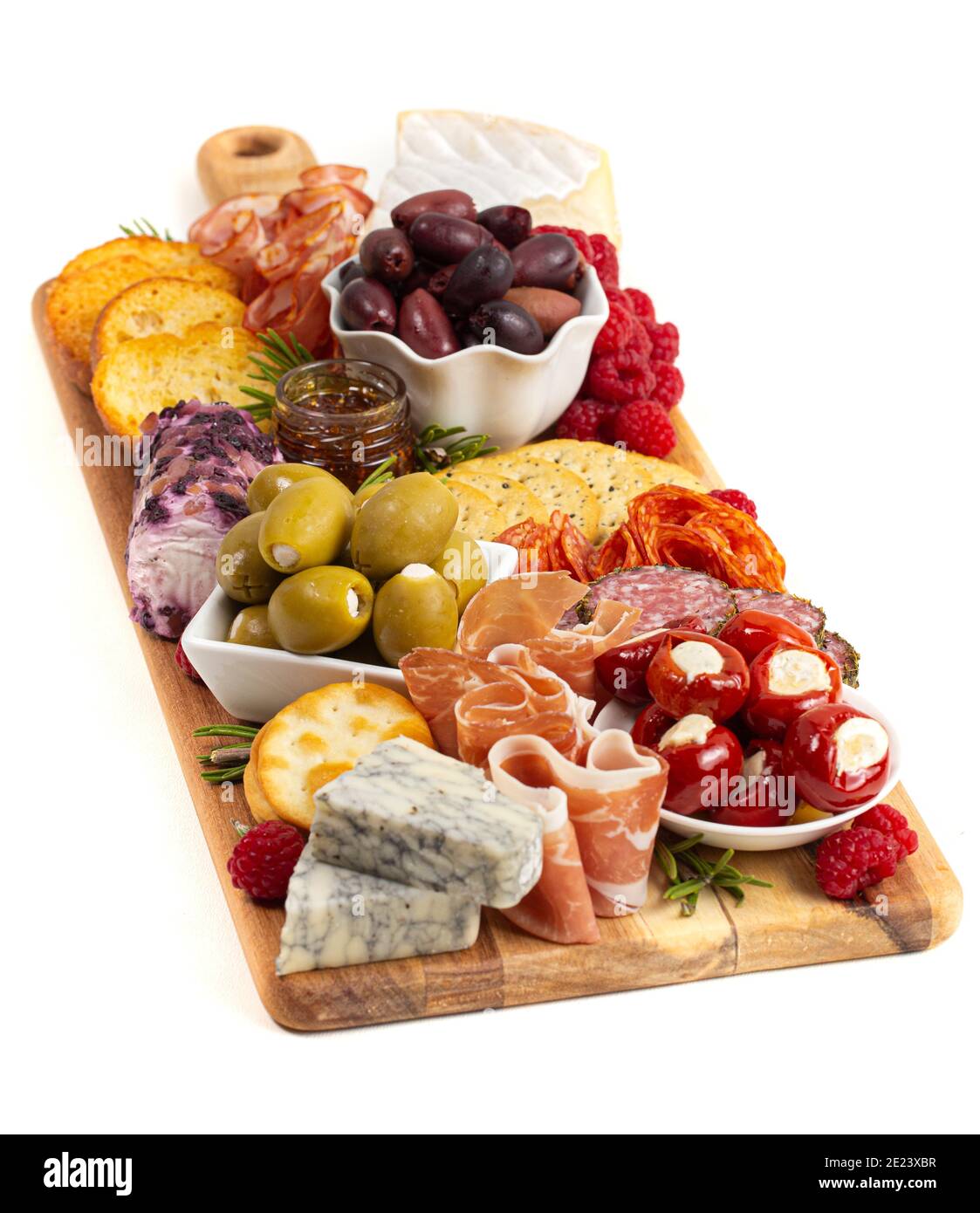 Savoury Charcuterie Board Covered in Meats Olives Peppers Berries and ...