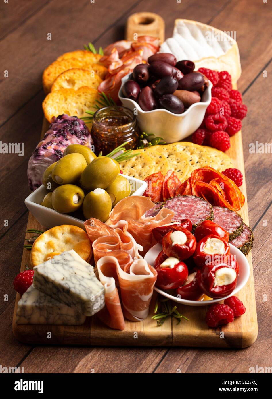 Savoury Charcuterie Board Covered in Meats Olives Peppers Berries and ...
