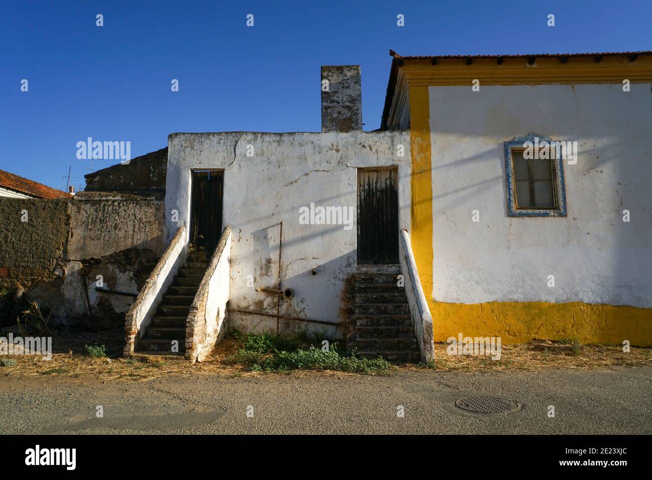 An old weathered building with an extension from the left side Stock ...