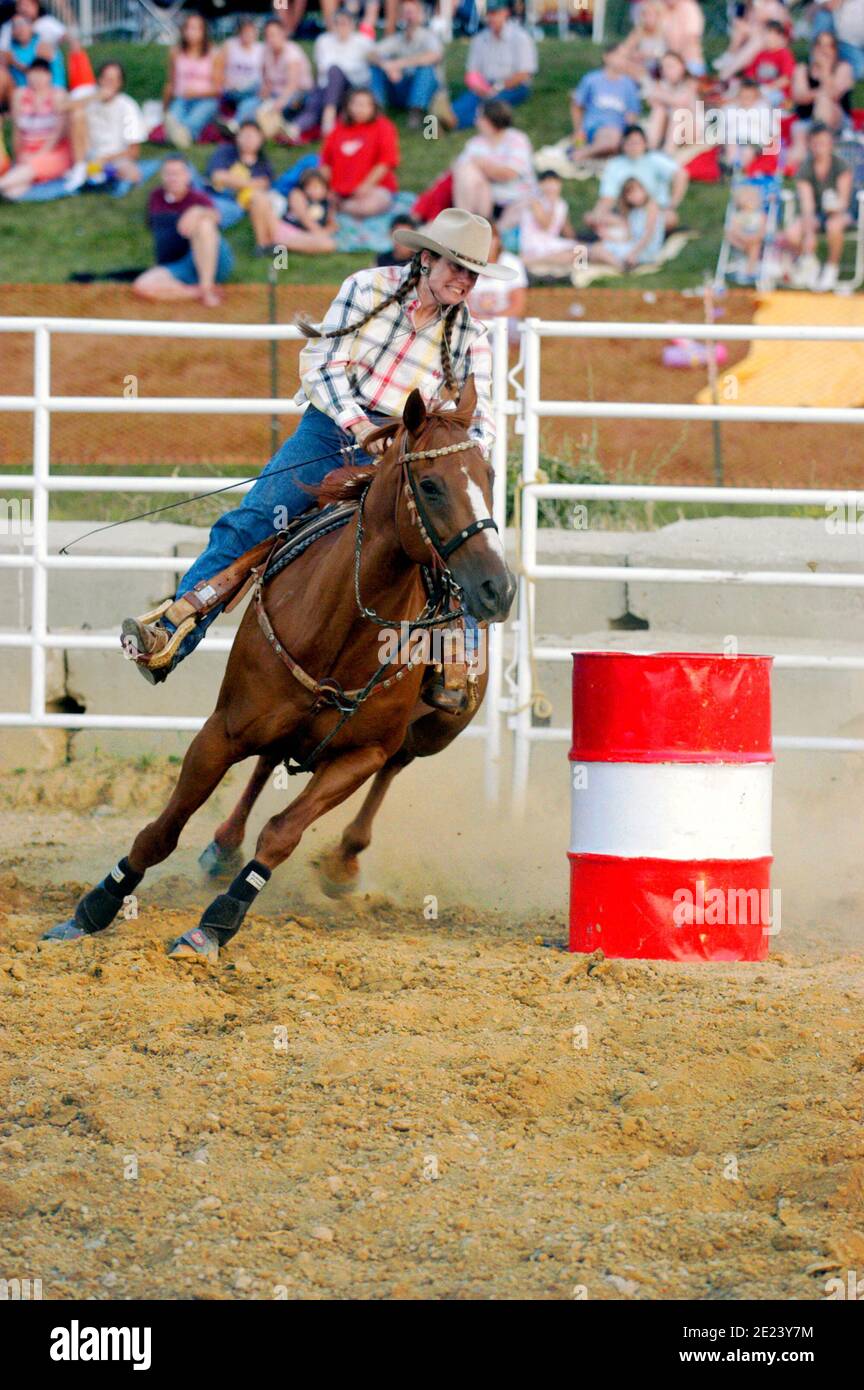 Female cowboy Competing in Rodeo Barrel Competition Stock Photo - Alamy