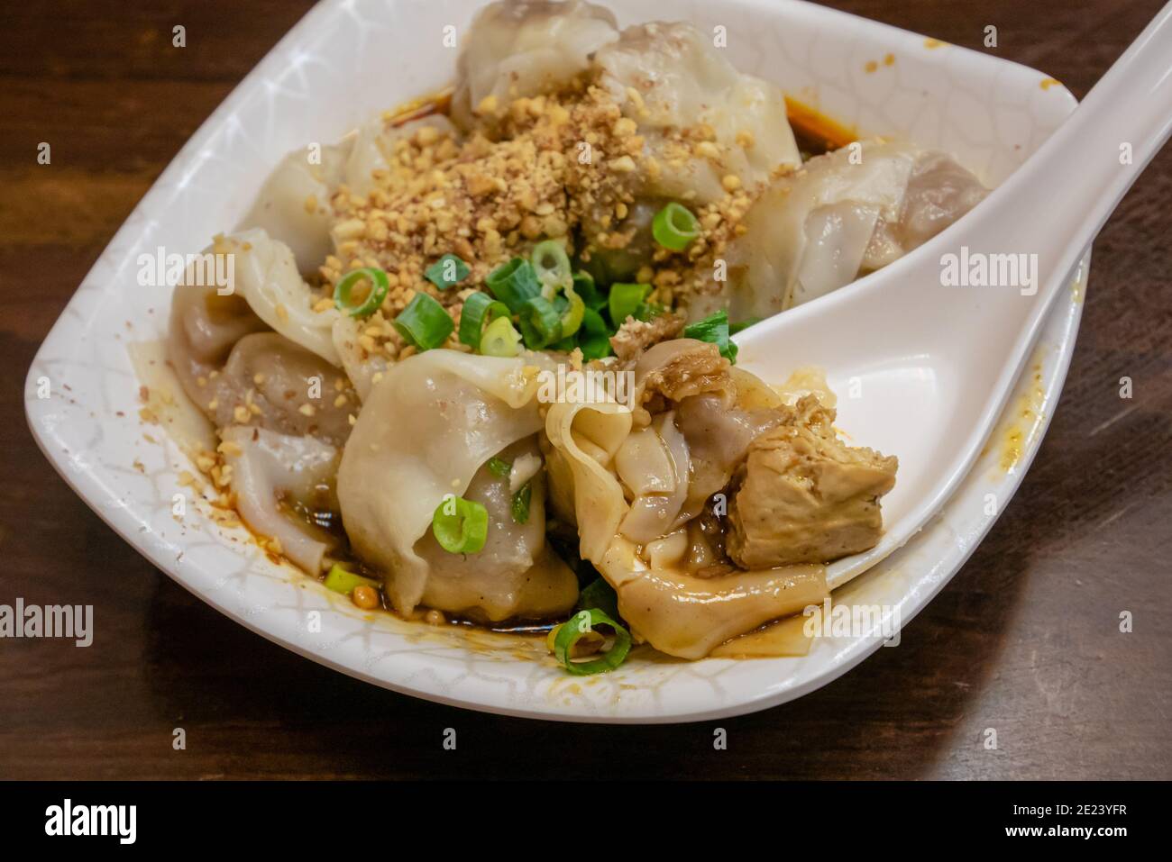 The close up of Taiwanese traditional steamed spicy stinky tofu wontons ...