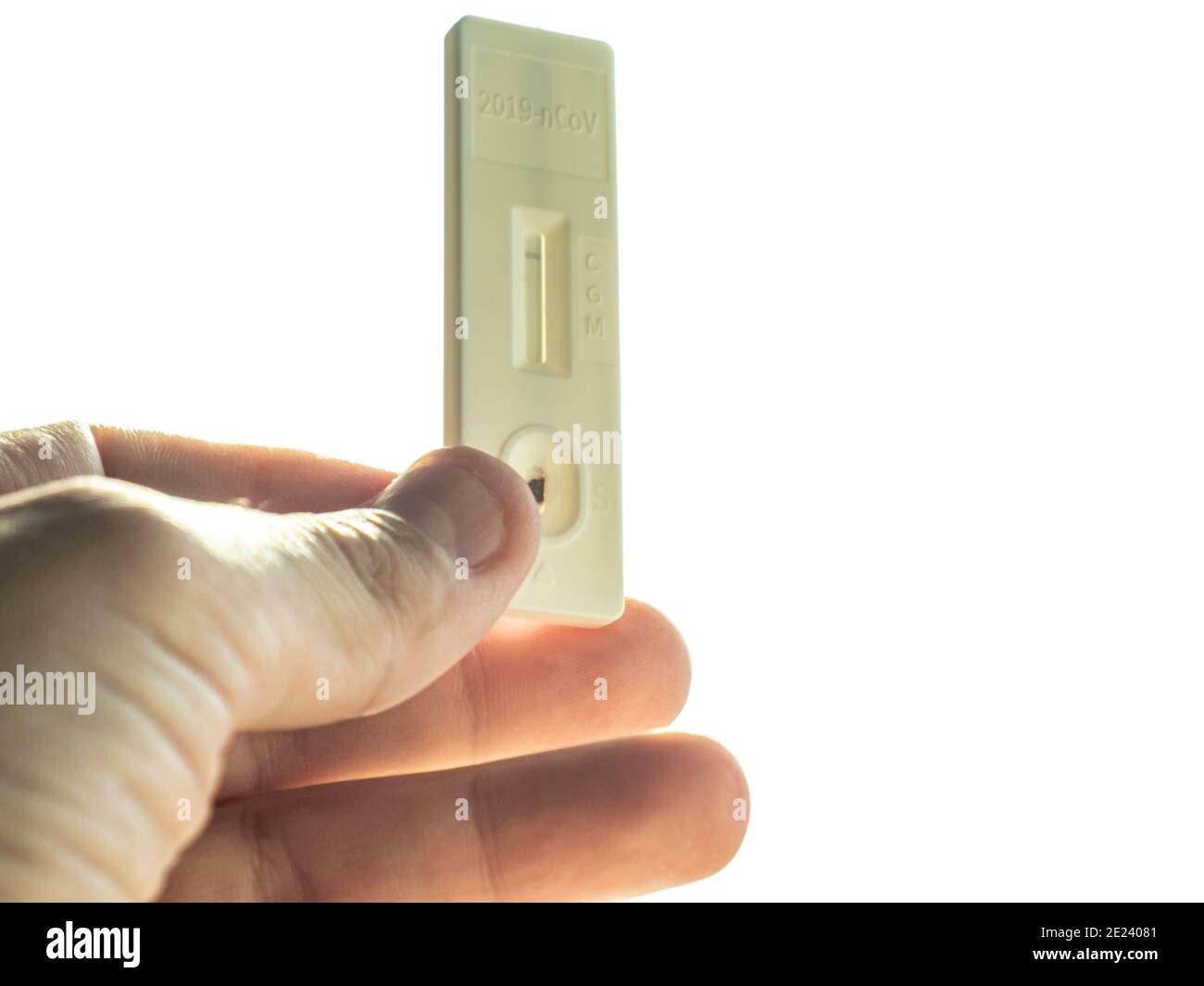 Closeup shot of a hand holding a negative antigen test isolated on a ...