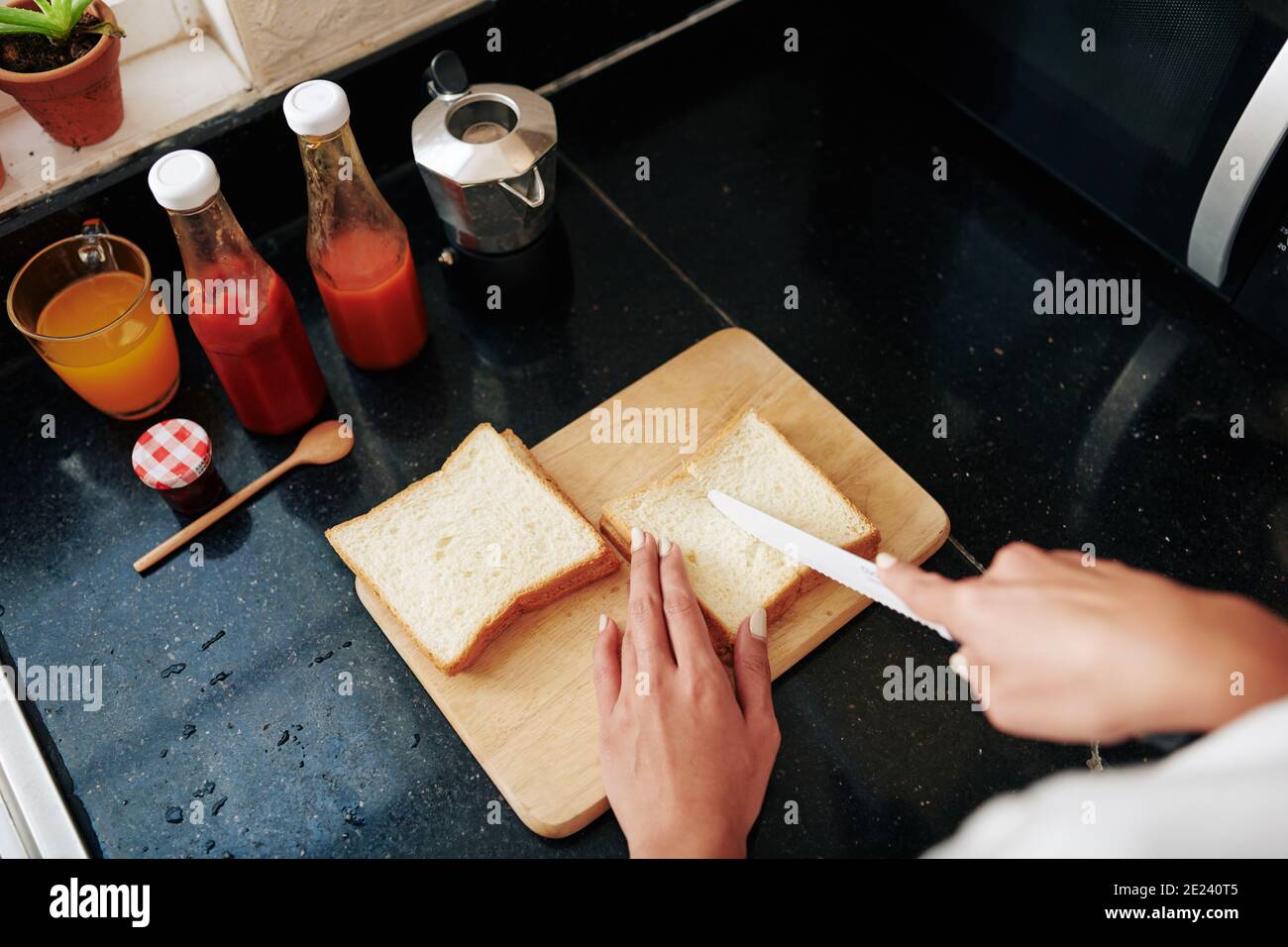 Woman making sandwiches Stock Photo - Alamy