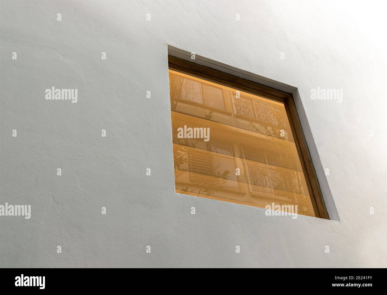 windows house reflected on the glass window on white walls. Selective ...