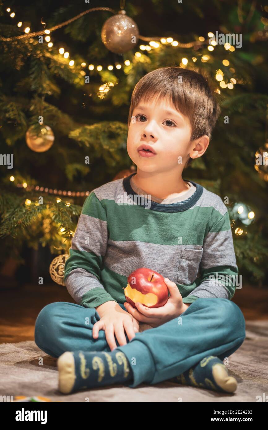 Boy under apple tree hi-res stock photography and images - Alamy