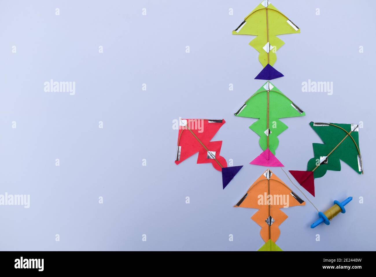 Miniature tiny kites with small spool of thread rolls, Patang with ...