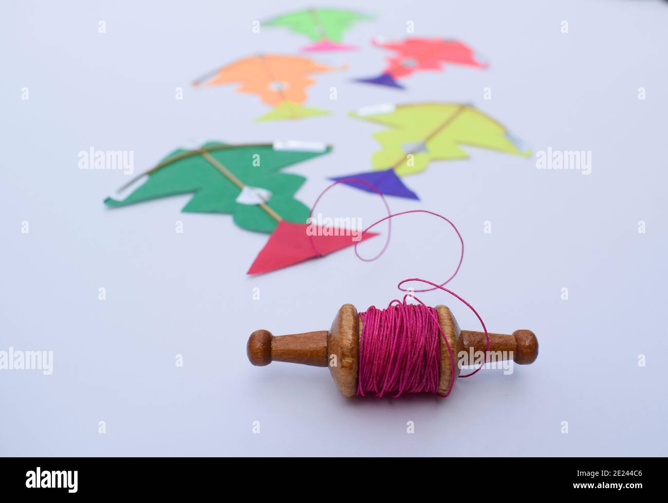 Miniature tiny kites with small spool of thread rolls, Patang with ...