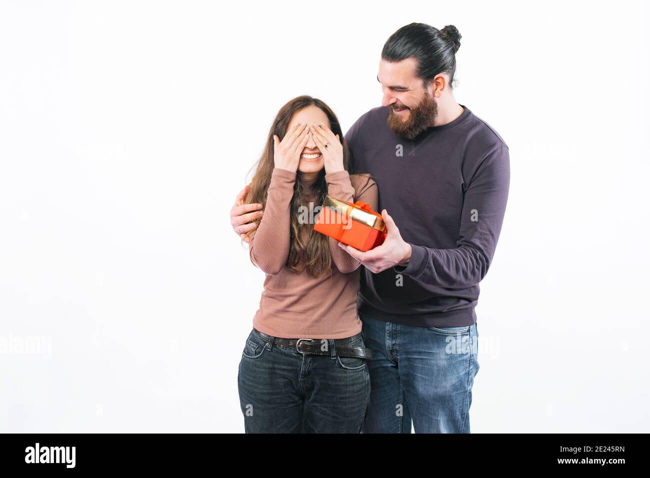 Husband giving a secret gift box for his wife Stock Photo - Alamy
