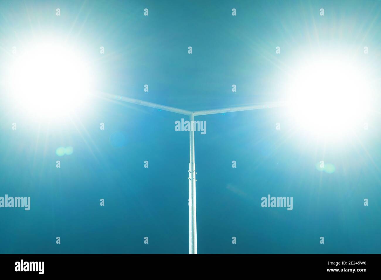 Photo of some double street lamp lighting at night Stock Photo - Alamy