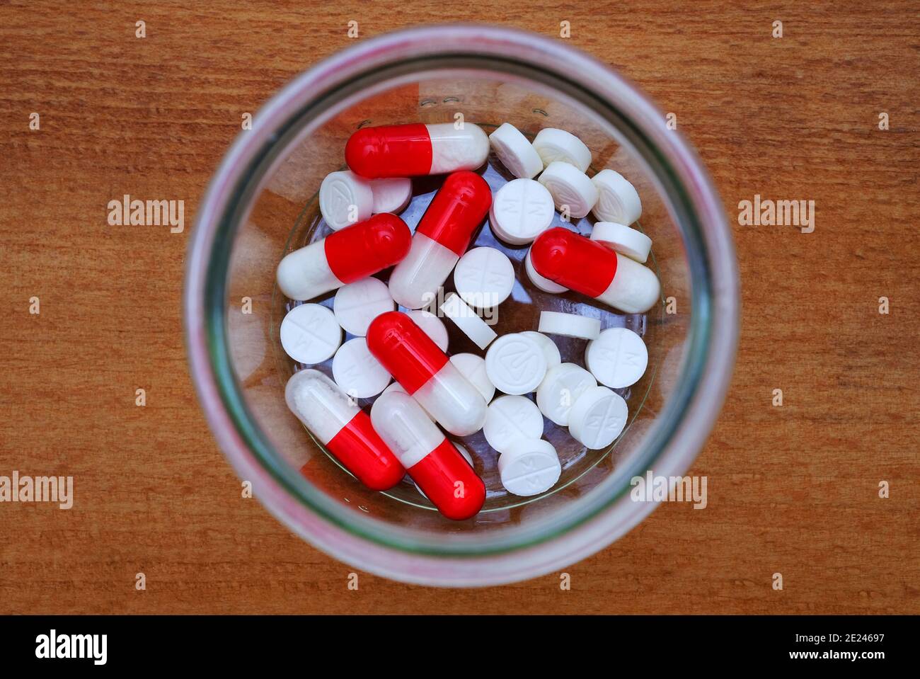 Round pills and pill bottle Stock Photo - Alamy