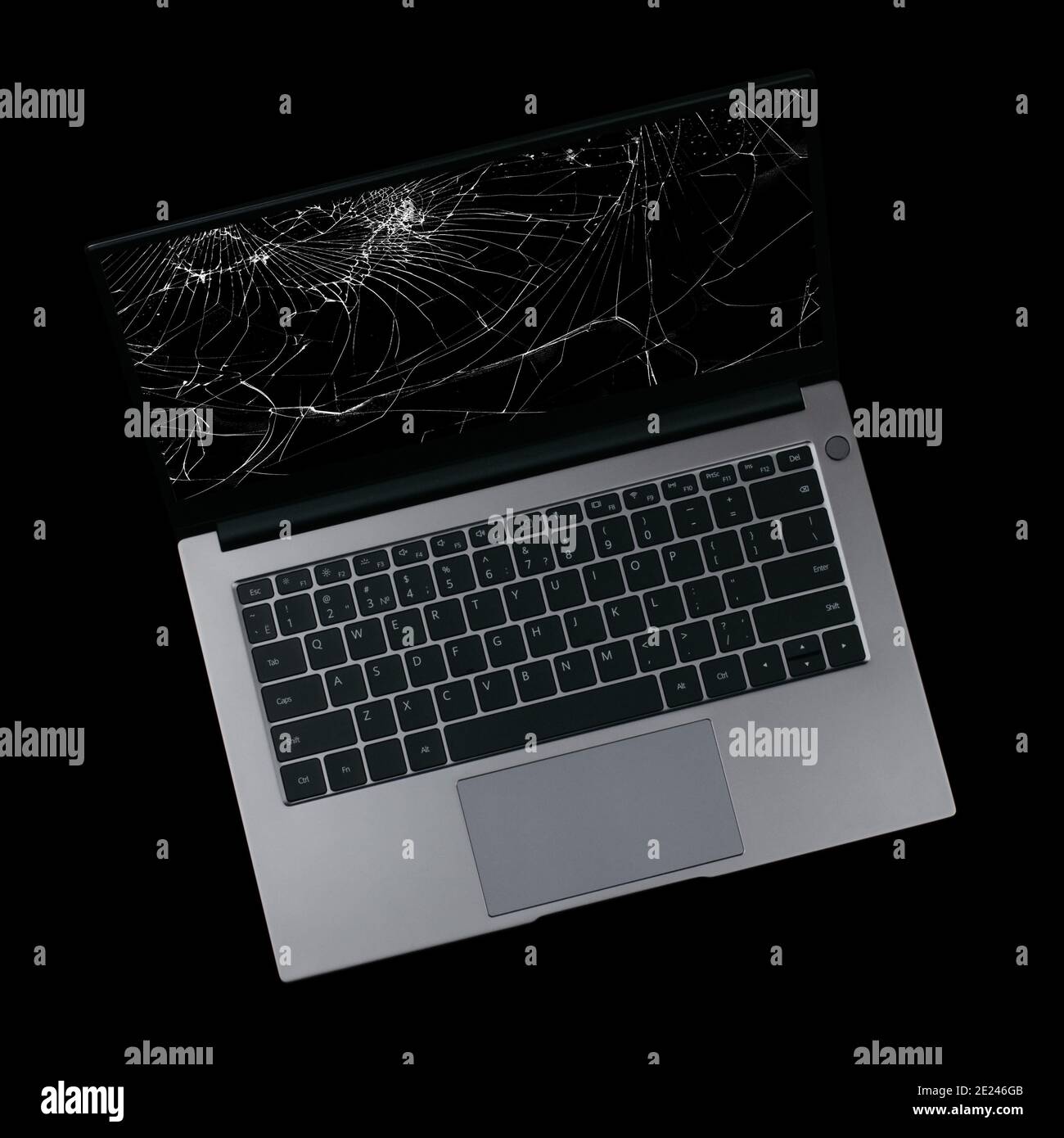 laptop with cracked screen isolated on black background close up Stock ...