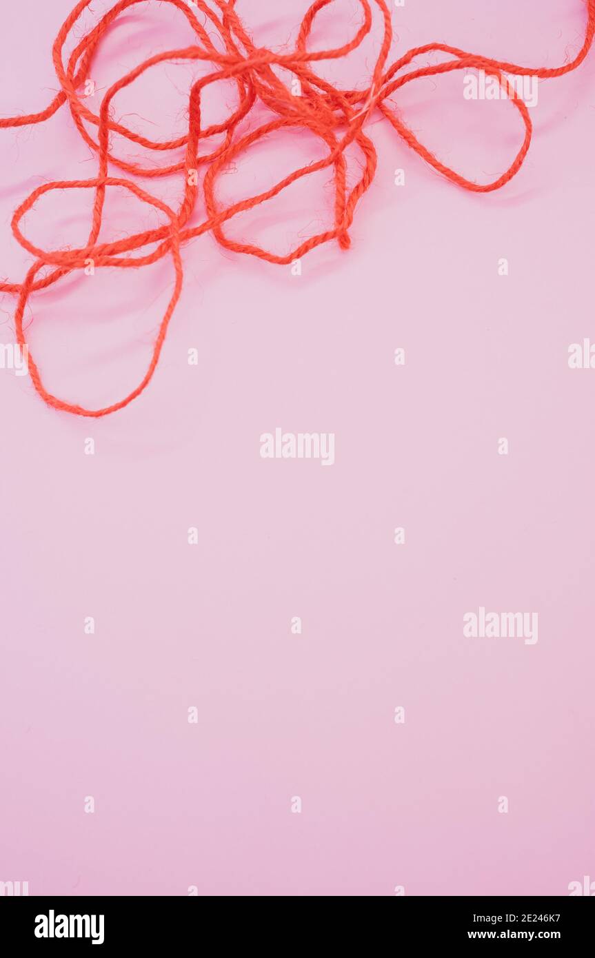 Vertical shot of bright red threads on a purple background Stock Photo ...