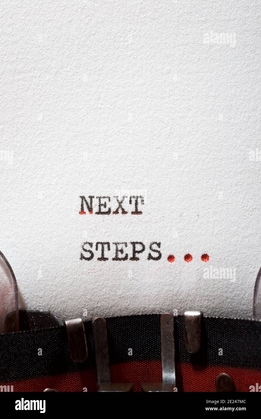 Next steps phrase written with a typewriter Stock Photo - Alamy